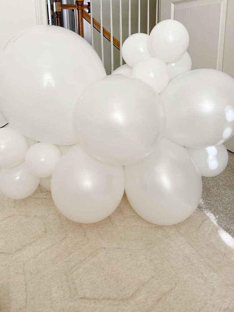 DIY Balloon Cloud- the perfect baby shower backdrop - traditionallycozy.com